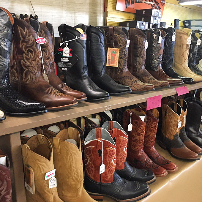 Cowboy boots standing at attention, each pair telling silent stories of rodeos never attended and line dances yet to be danced.