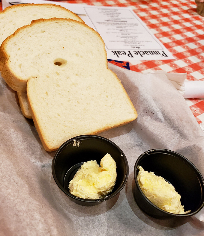 Fresh-baked bread with butter cups standing by. Carb counters, look away now&mdash;some temptations are worth every delicious calorie.