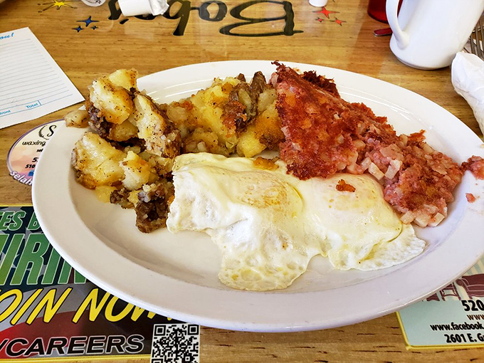 The breakfast trinity: golden eggs, crispy home fries, and ham that's been given the respect it deserves. Simple perfection on a plate.