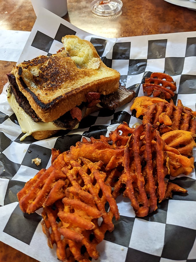 A sandwich that requires both hands and several napkins – Texas toast barely containing the alliance of brisket, bacon and melted cheese.