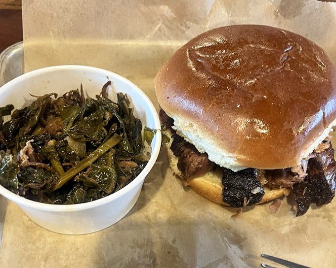 A brisket sandwich and collard greens&mdash;proof that happiness can indeed be served on a paper-lined plate.
