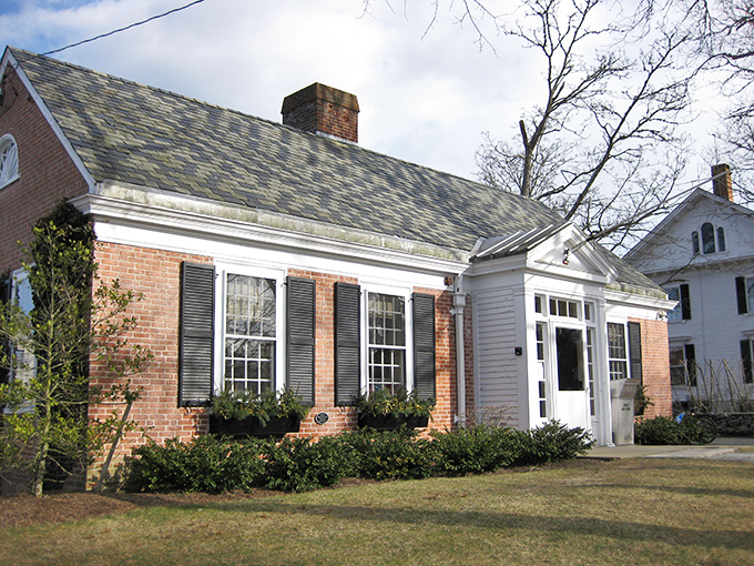 Brownell Library combines brick charm with white trim elegance. Those window boxes aren't just pretty&mdash;they're a metaphor for this town's cultivated yet unpretentious character.