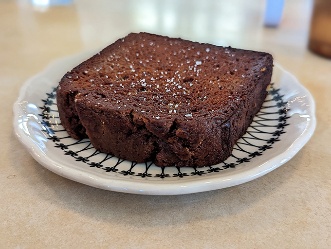 This brownie doesn't need frosting to make its point. Dense, rich, and unapologetically chocolate – dessert minimalism at its finest.