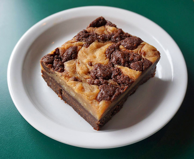 This brownie square is having an identity crisis between fudge and cake, and honestly, we're here for this delicious confusion of textures.