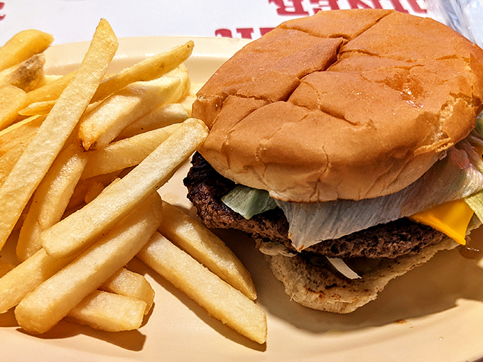 This isn't just a burger&mdash;it's architectural perfection between buns, with golden fries standing guard like delicious sentinels.