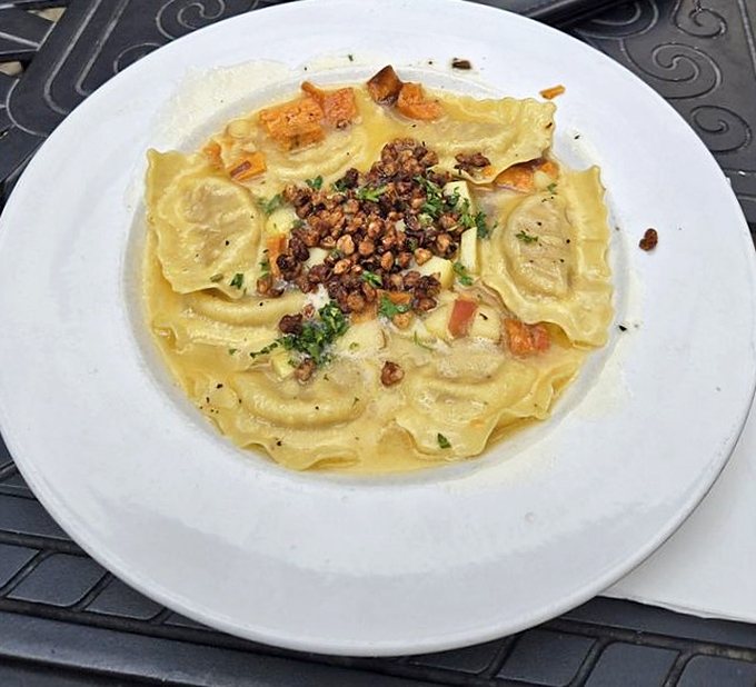 Butternut squash ravioli swimming in a delicate sauce. These little pillows of flavor are like edible treasure chests waiting to be discovered.