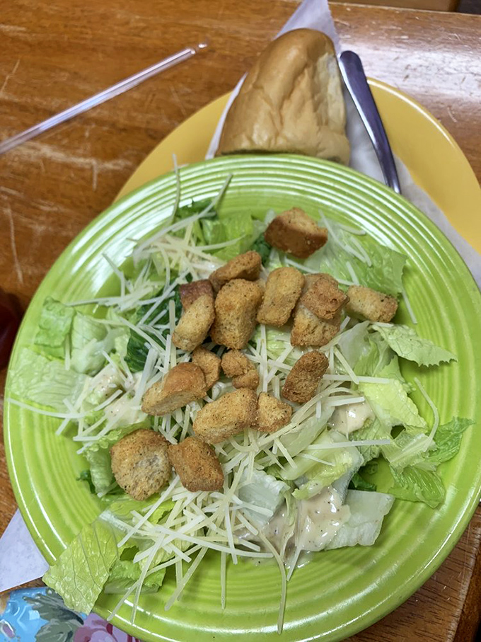 Caesar salad with fresh mozzarella pearls, because even the lighter options get the gourmet treatment at this purple palace.