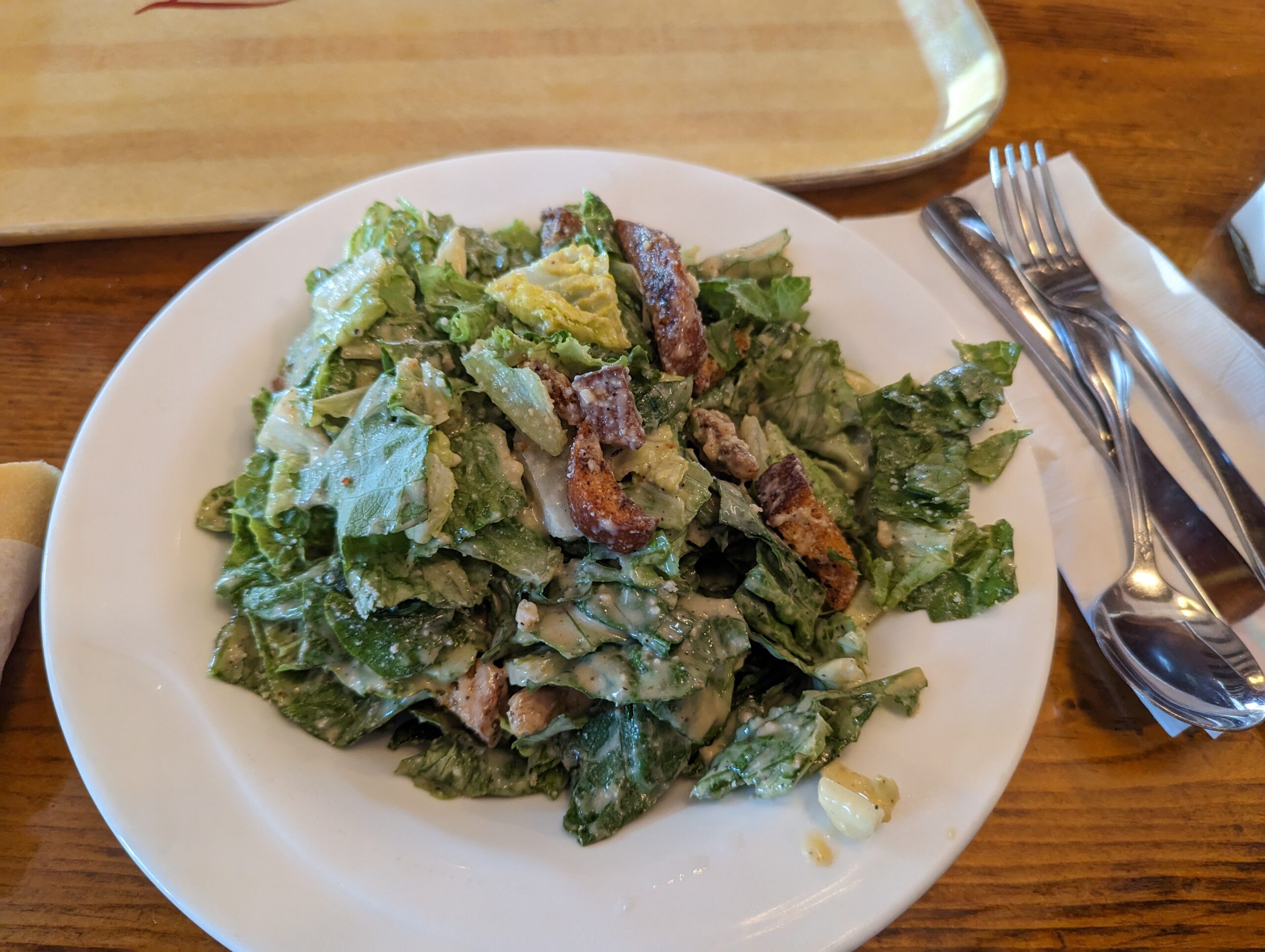 Caesar salad that reminds you vegetables can be exciting&mdash;crisp romaine, house-made croutons, and dressing that makes store-bought versions weep with inadequacy.