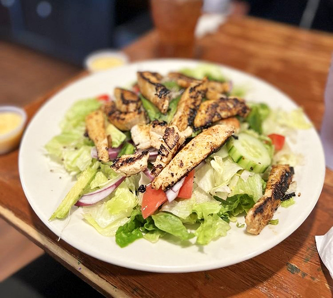 Not all heroes wear capes &ndash; some come as grilled chicken atop fresh greens. A salad that satisfies without a hint of sacrifice.
