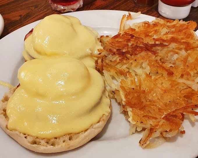 Eggs Benedict with a Danish twist—the hollandaise sauce blankets those English muffins like a rich, buttery sunrise over Copenhagen harbor.