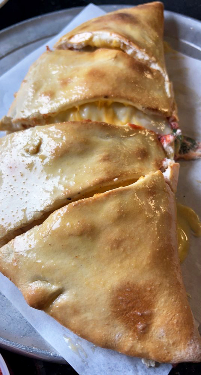 This calzone isn't just folded pizza&mdash;it's a self-contained miracle of cheese and fillings that makes you wonder why we ever eat anything else.