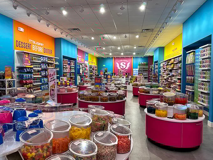 A kaleidoscope of candy bins where diet plans go to die and childhood memories come rushing back with every colorful scoop.