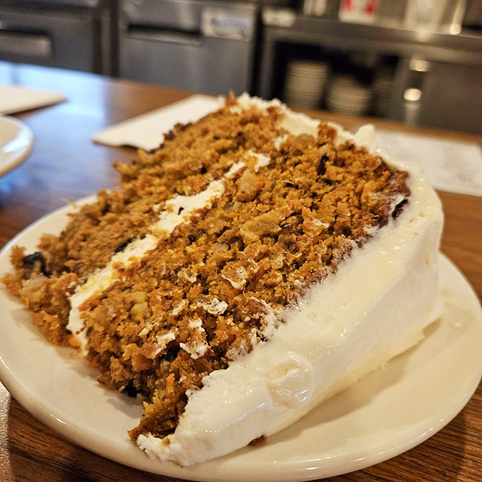 Layer upon layer of moist carrot cake embraced by cream cheese frosting. This isn't dessert&mdash;it's an edible hug that makes everything better.