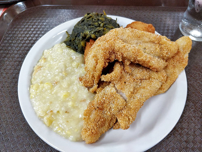 Catfish wearing its cornmeal coat like Sunday best, keeping company with creamed corn that would make your grandmother proud.