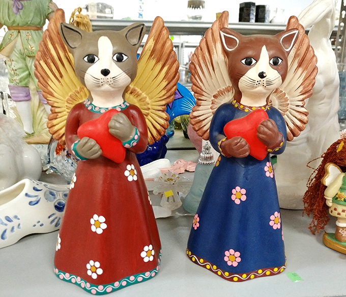 Angel cats with hearts and flowers&mdash;the kind of kitschy treasure that makes you smile every time you dust it.