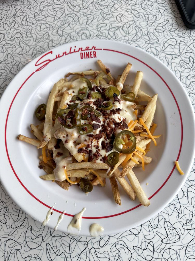 Loaded fries that require both a fork and a strategy&mdash;melted cheese, jalape&ntilde;os, and bacon bits creating a flavor party worth the napkin investment.