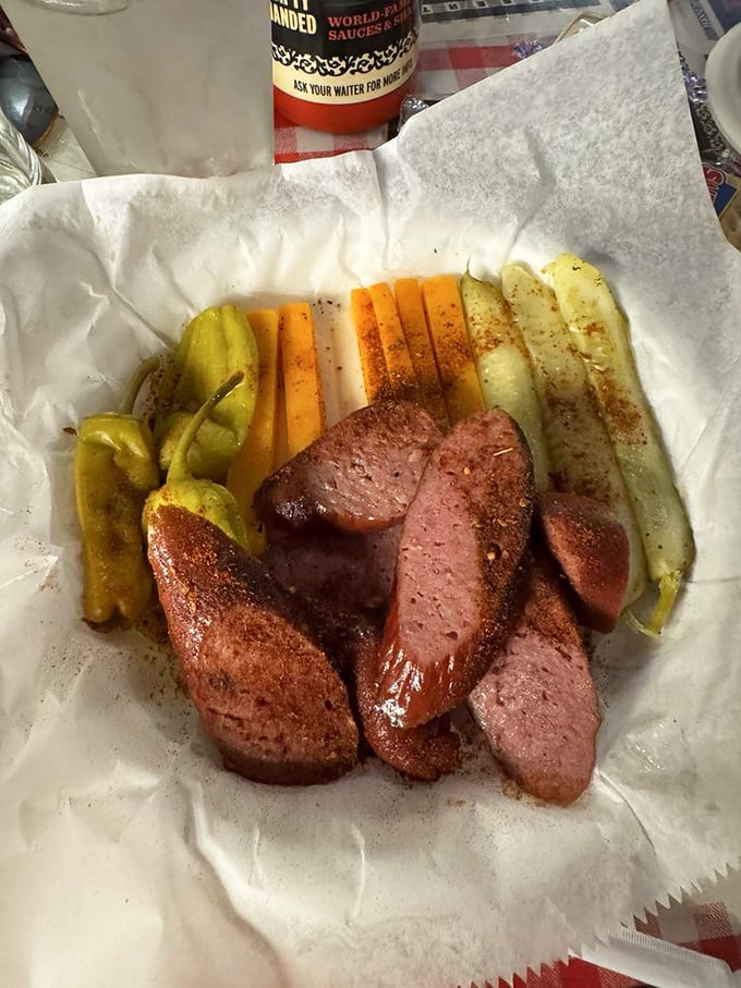 Smoked sausage and pickles: the unsung heroes of the barbecue spread. These savory bites prove the Rendezvous masters more than just ribs.