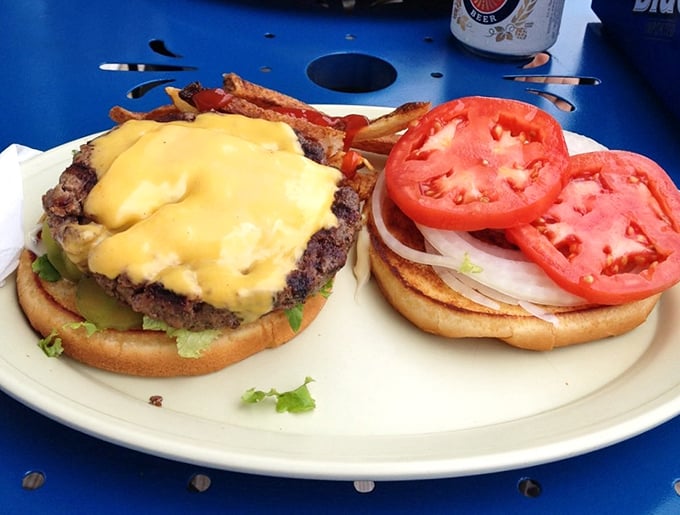 A proper Ohio cheeseburger doesn't whisper, it announces itself. Half-pound of Angus topped with melty American cheese and fresh tomatoes&mdash;simple perfection. 
