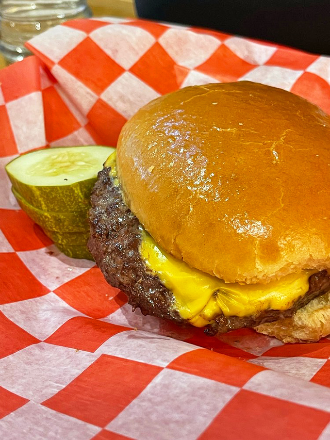 The cheeseburger that launched a thousand road trips, complete with that perfect cheese melt that haunts your dreams for weeks afterward.