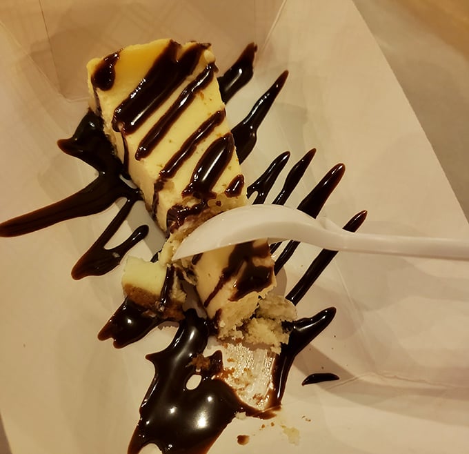 Chocolate drizzle on cheesecake &ndash; because after all that seafood, you've earned this sweet finale.