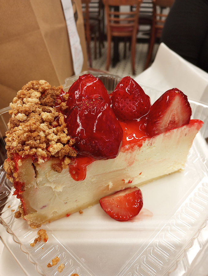 A slice of strawberry cheesecake that makes a compelling argument for dessert being its own food group &ndash; creamy, sweet, and worth every delicious calorie.