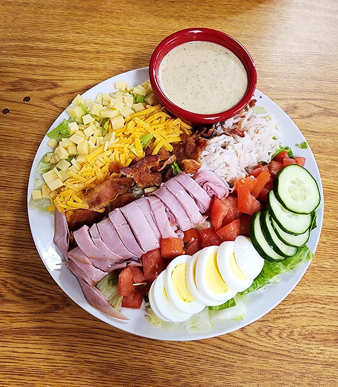 A chef salad that defies the "sad lunch" stereotype with its colorful parade of proteins, vegetables, and that perfectly placed hard-boiled egg.