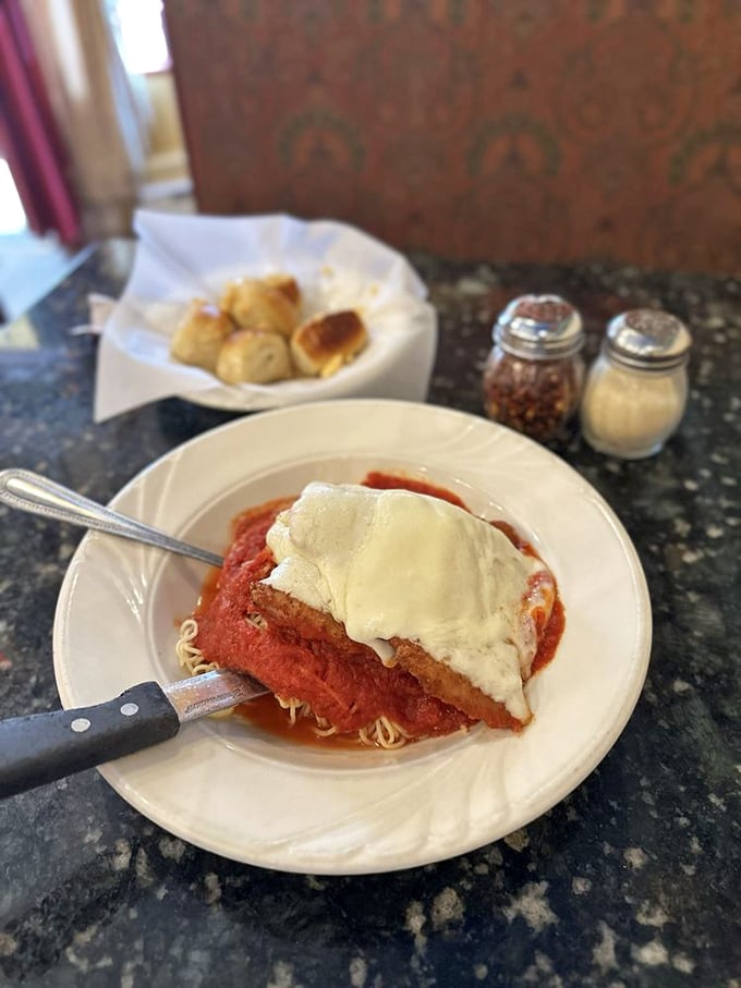 Chicken Parmesan that makes you understand why it's a classic. That perfect ratio of crispy exterior, tender chicken, tangy sauce, and melty cheese is comfort defined.