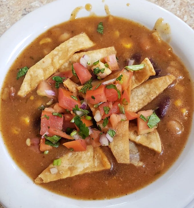 Tortilla soup that could cure anything from a cold to a broken heart. Those crispy tortilla strips are the life rafts in a sea of savory goodness.