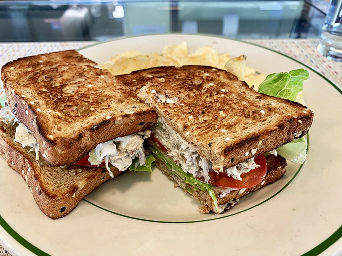This sandwich isn't just lunch&mdash;it's architecture. Perfectly toasted bread supporting layers of chicken salad in a delicious balancing act. 