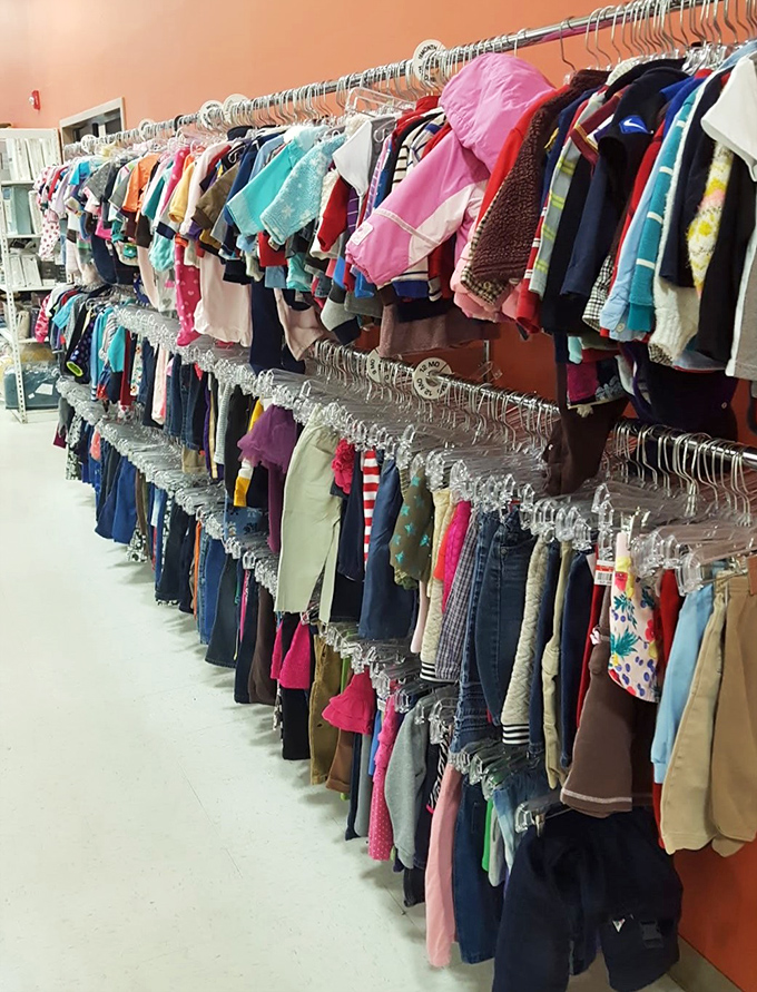 Children's clothing organized by size and color creates a rainbow of possibilities. Kids outgrow clothes faster than Minnesota winters last&mdash;smart parents shop here.