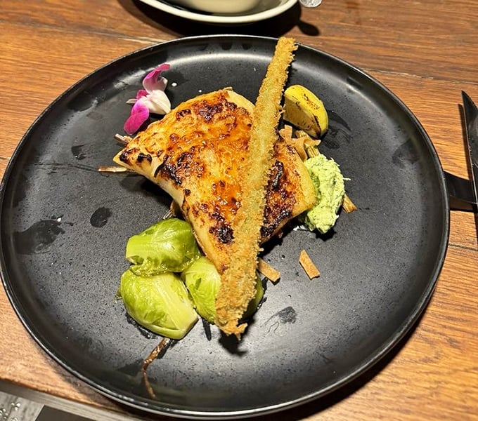 Perfectly caramelized fish with Brussels sprouts? Someone in that kitchen understands that surf deserves equally impressive supporting actors.