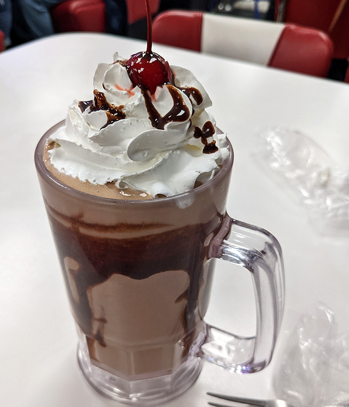 This isn't just a chocolate milkshake&mdash;it's a tower of indulgence with whipped cream architecture that deserves its own blueprint.