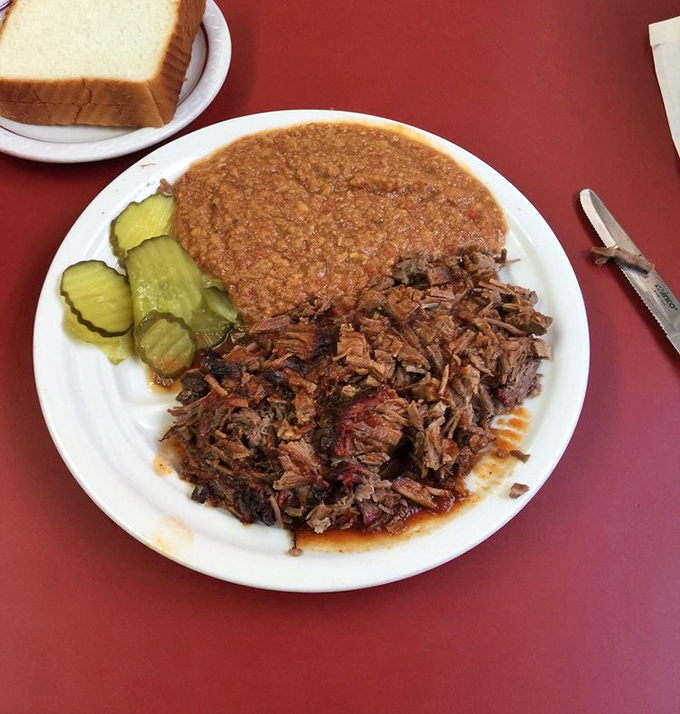 Chopped BBQ beef with Brunswick stew and pickles&mdash;a plate that says "Welcome to Georgia" better than any roadside sign ever could.
