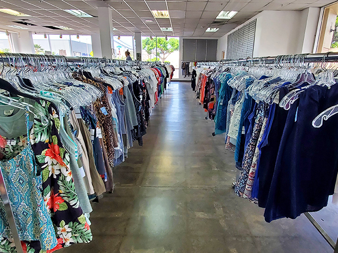 A glimpse down the colorful canyon of women's fashion, where vintage muumuus and contemporary styles create a uniquely Hawaiian shopping experience.