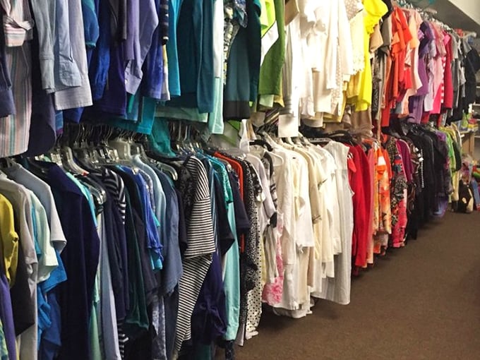 The clothing section: where rainbow organization meets bargain hunting in a technicolor dream of secondhand fashion.