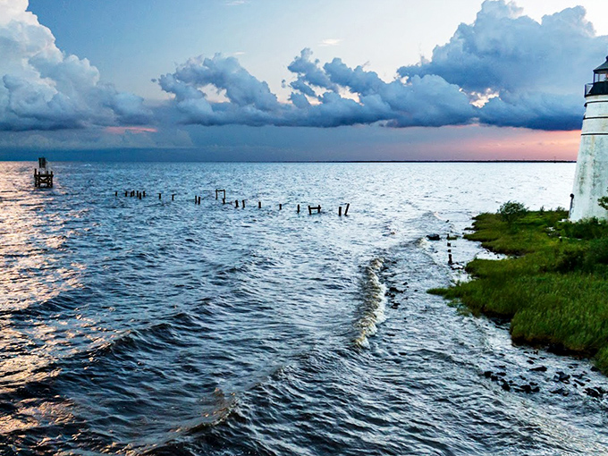 As twilight settles over Lake Pontchartrain, the lighthouse begins its nightly vigil, its automated beam a modern continuation of a timeless tradition.