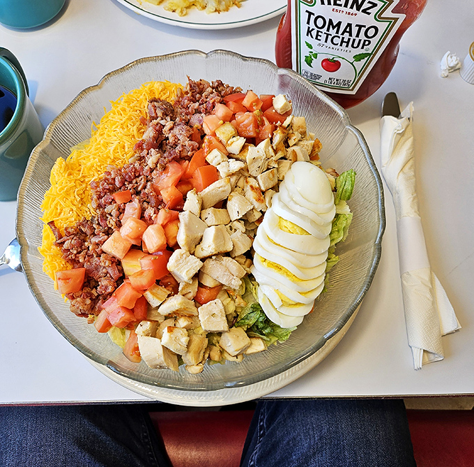 A Cobb salad arranged with military precision&mdash;each ingredient standing at attention, ready to report for flavor duty. Even salads mean business here.