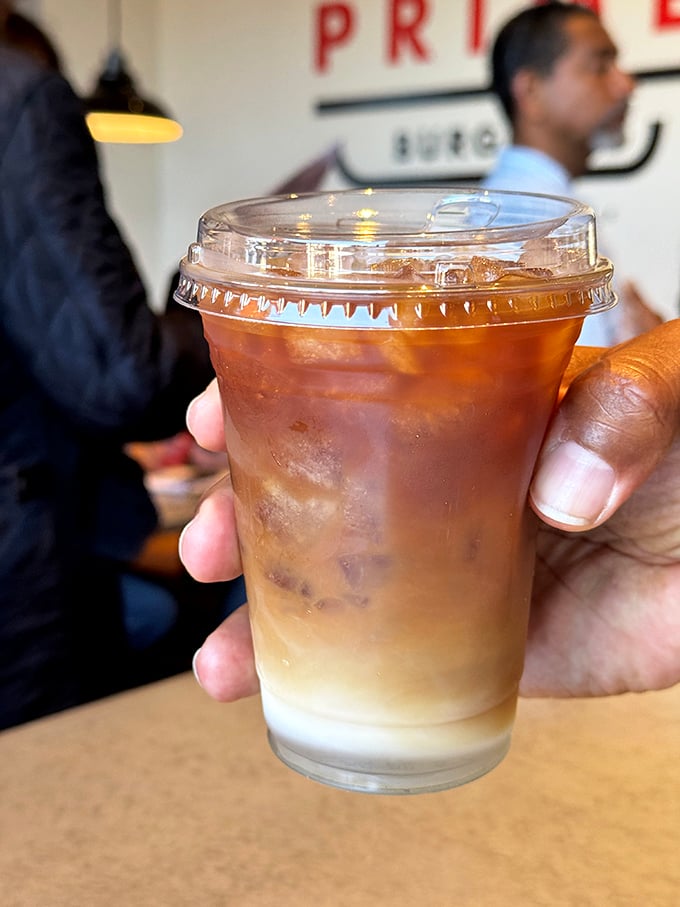 That layered iced coffee isn't just a beverage, it's a work of art. The kind of drink that makes you forget you're in a burger joint.