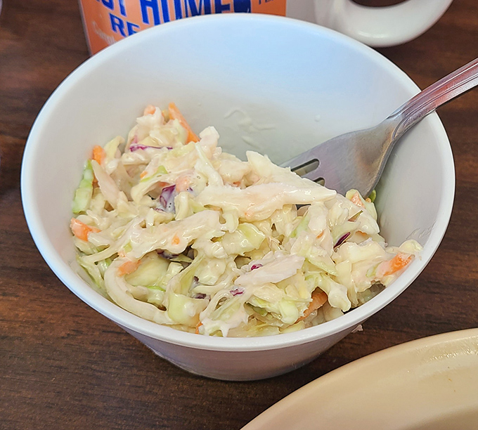 Coleslaw that doesn't know it's supposed to be a side dish. Fresh, crisp, and demanding attention despite its supporting role status.