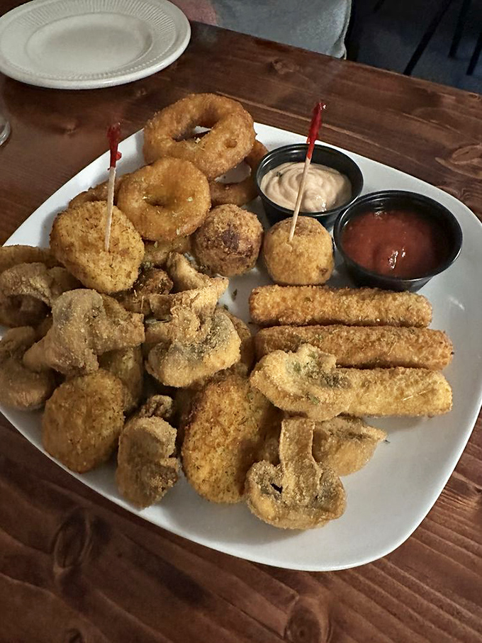 A platter that answers the eternal question: "Why choose one fried thing when you can have them all?" Served with dipping sauces for your dunking pleasure.