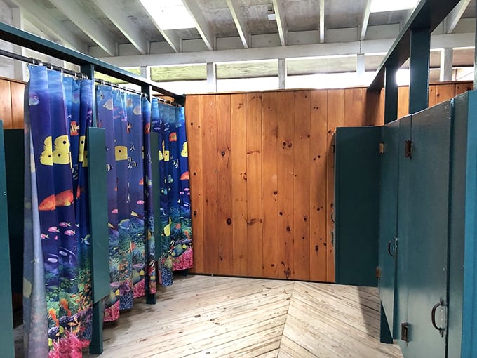 Shower facilities with unexpected personality&mdash;underwater scenes make cleaning up after a day outdoors feel like an extension of the adventure.