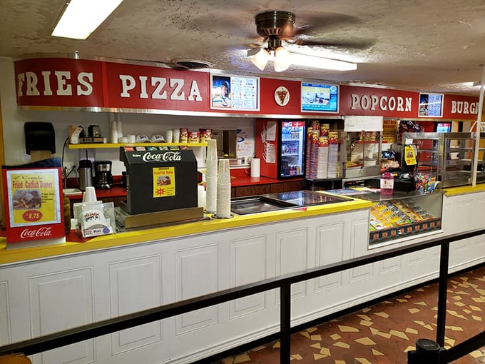 Behind this counter, movie night essentials await: popcorn, pizza, and those impossibly perfect fries that taste better with a film.