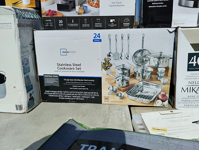 Kitchen dreams materialize in cardboard boxes. This 24-piece cookware set promises culinary adventures without the Williams-Sonoma price tag.