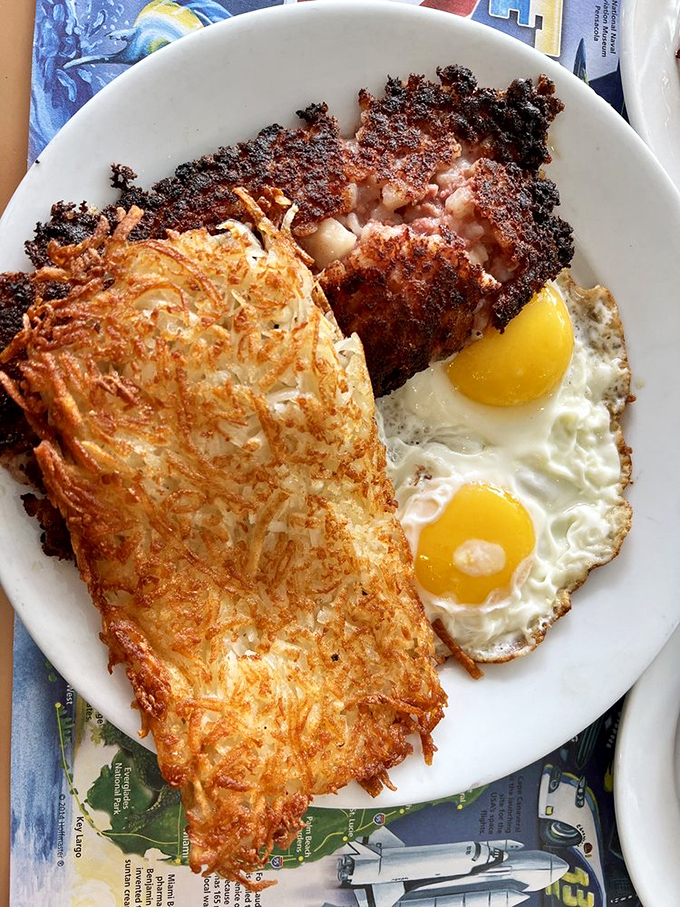 Corned beef hash with that essential crispy edge, hash browns that could win awards, and sunny-side-up eggs bringing pure joy to the plate.