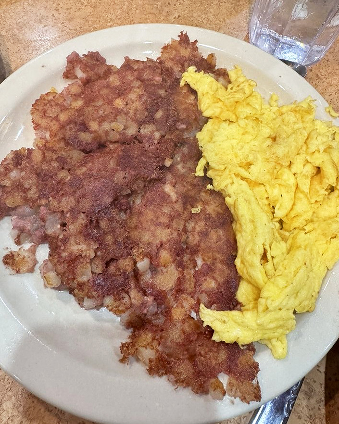 Corned beef hash that could convert vegetarians &ndash; crispy edges meeting tender middle in breakfast harmony.