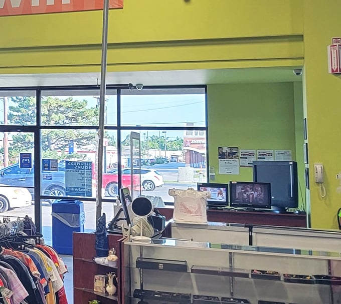 The checkout area—final gateway between browsing and ownership. Those televisions have witnessed countless "I can't believe I found this!" moments of thrifting triumph.