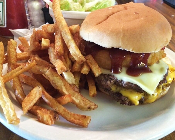 The Cowboy Burger &ndash; when one patty just won't do and onion rings decided they belonged inside the burger, not beside it.