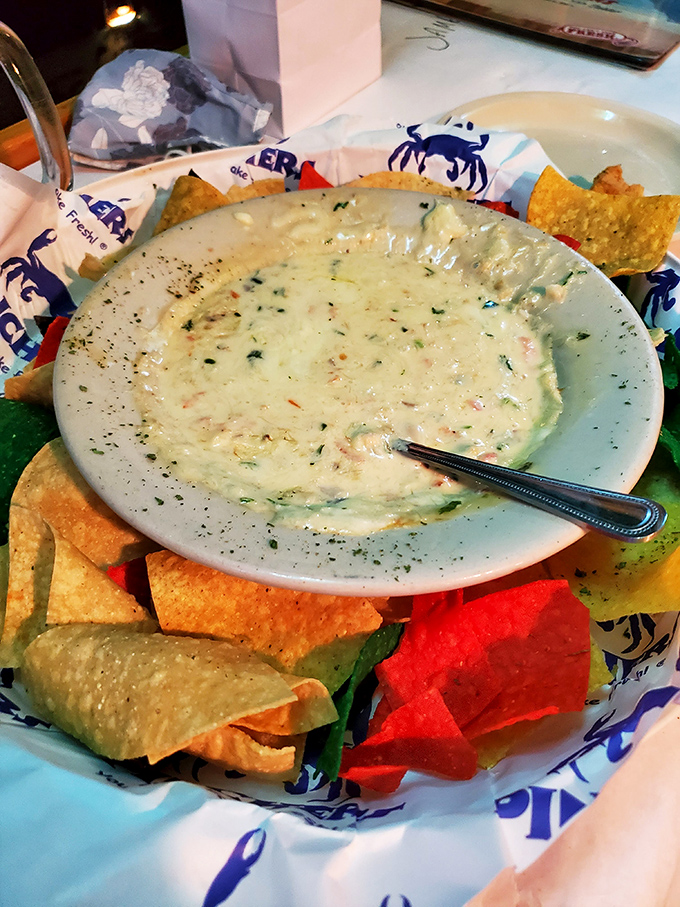 This creamy crab dip surrounded by colorful tortilla chips isn't just an appetizer&mdash;it's the beginning of a beautiful friendship between your taste buds and the sea.