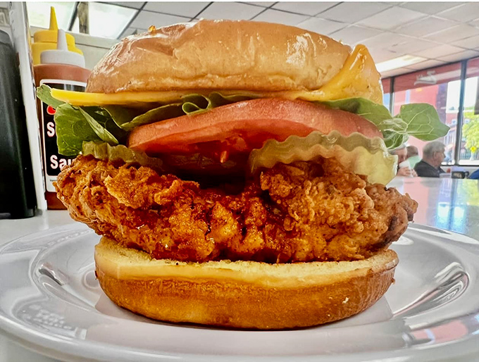 The crispy chicken sandwich—golden, crunchy perfection nestled between a soft bun with fresh toppings for those avoiding the frank.