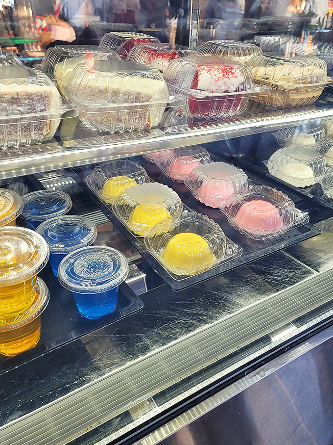 Sweet temptations behind glass &ndash; colorful gelatins and cakes that would make your dentist wince but your inner child rejoice.